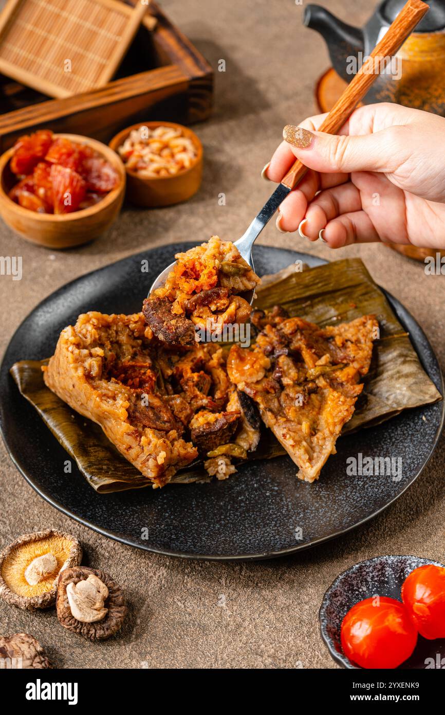 Zongzi is a traditional Chinese food made of glutinous rice stuffed ...