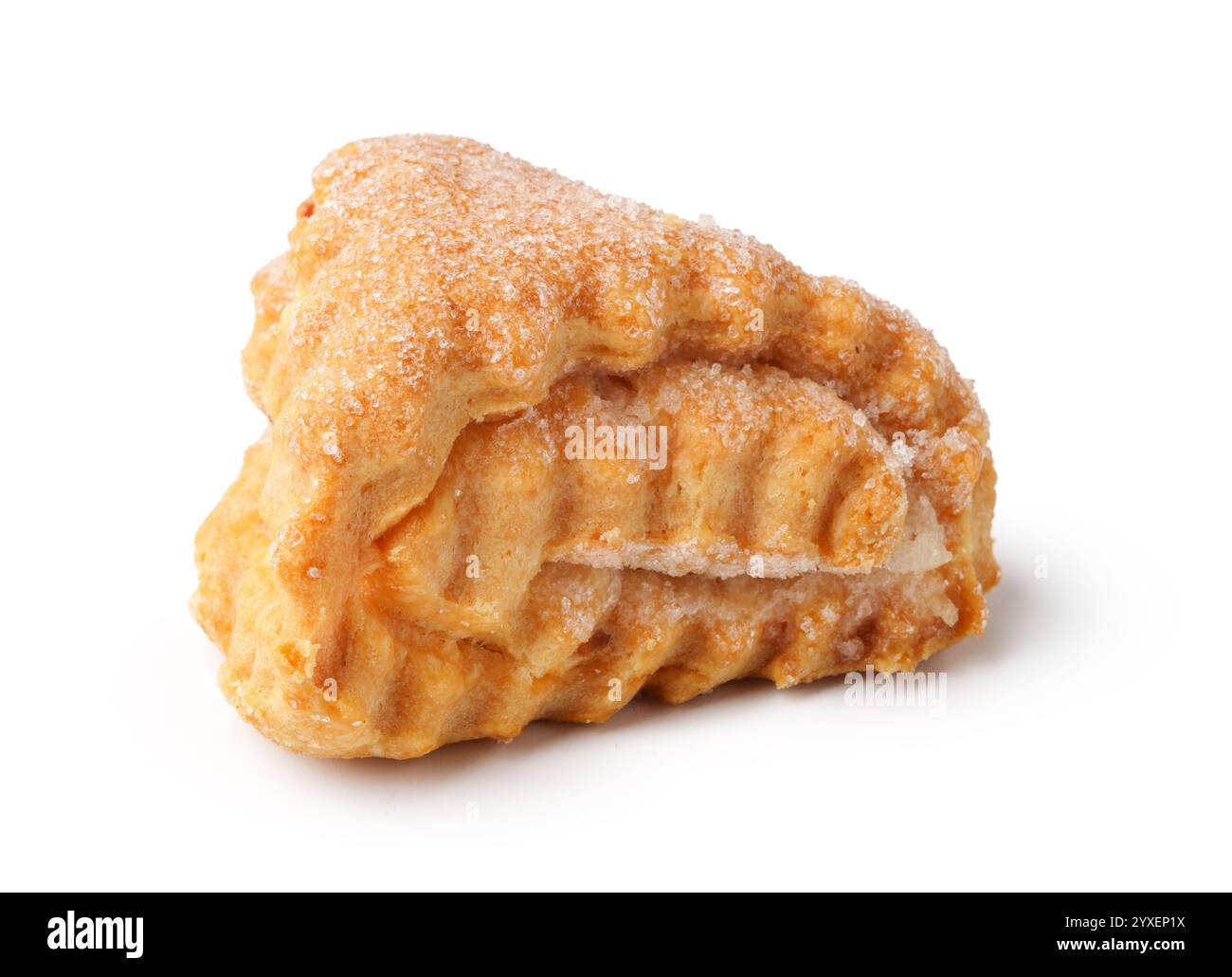Delicious sugar-dusted pastry shaped like a triangle on a plain ...