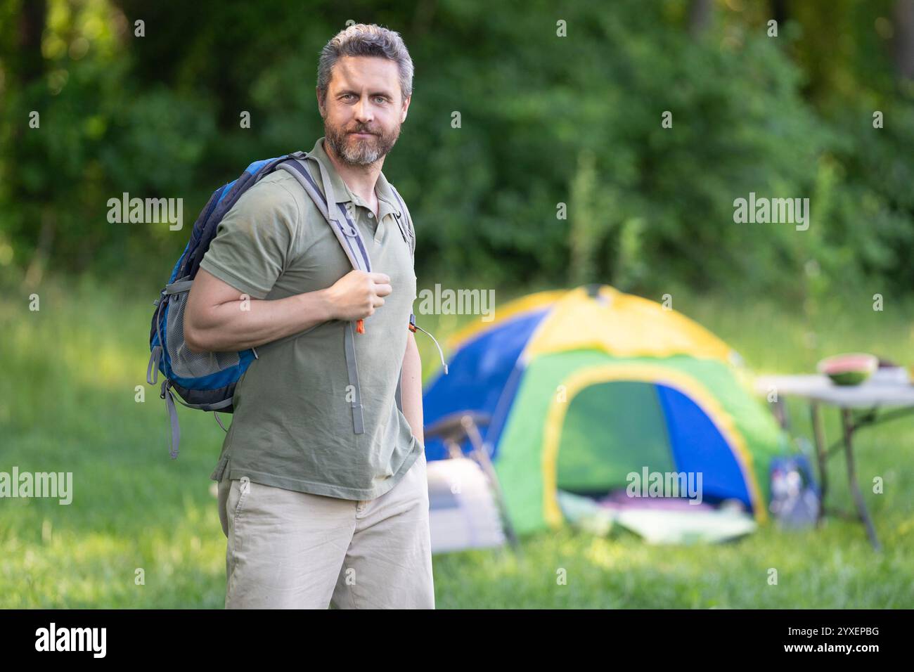 Camp adventure. Hiking concept. Camping tent. Man on camp in the forest ...