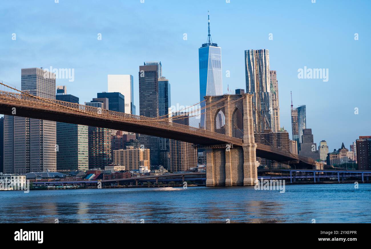 Brooklyn bridge leads to Manhattan. Urban architecture of New York city ...