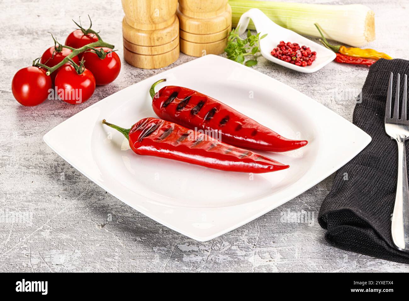 Grilled red spicy pepper snack in the bowl Stock Photo - Alamy