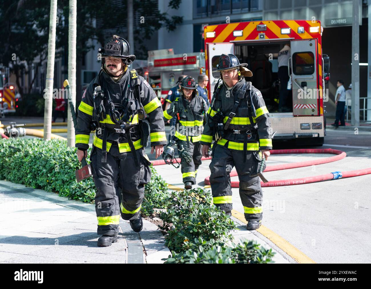 Miami, Florida, USA - December 01, 2024: Firefighter teamwork in fire ...