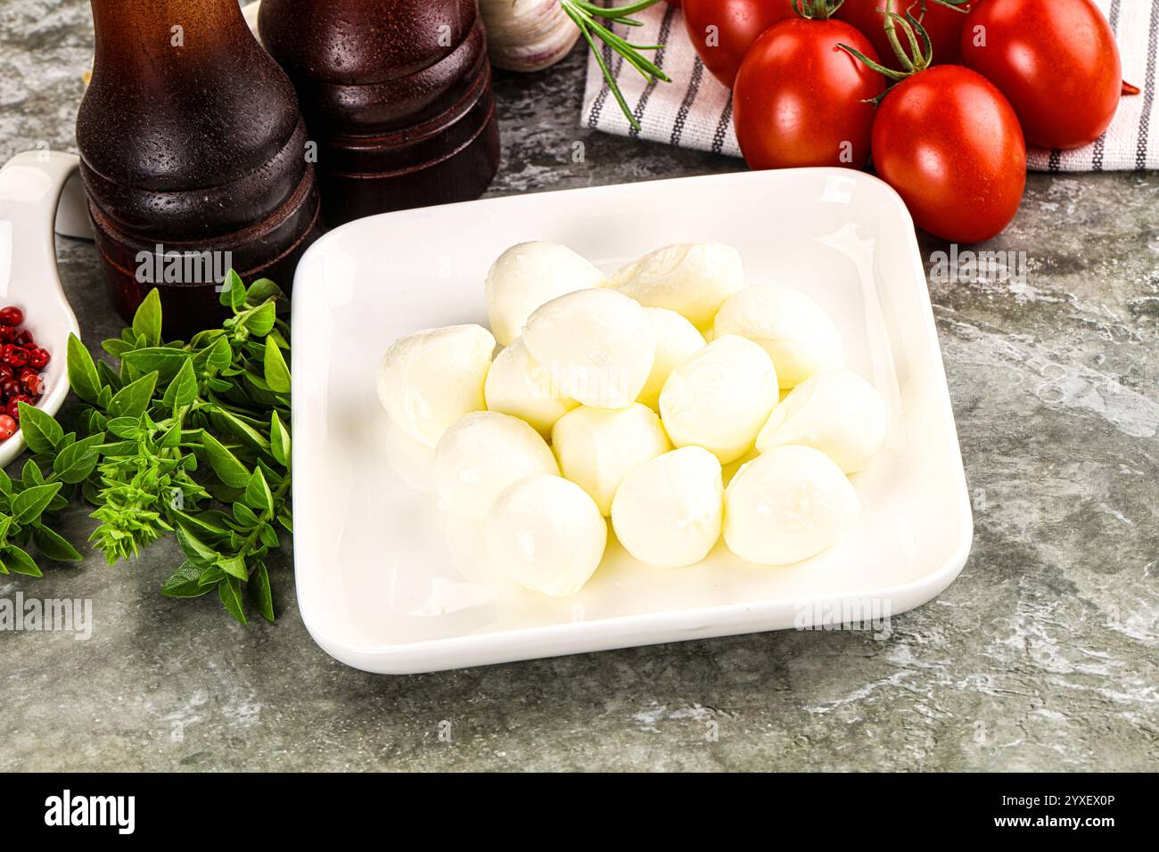 Small mozzarella mini cheese balls served basil Stock Photo - Alamy