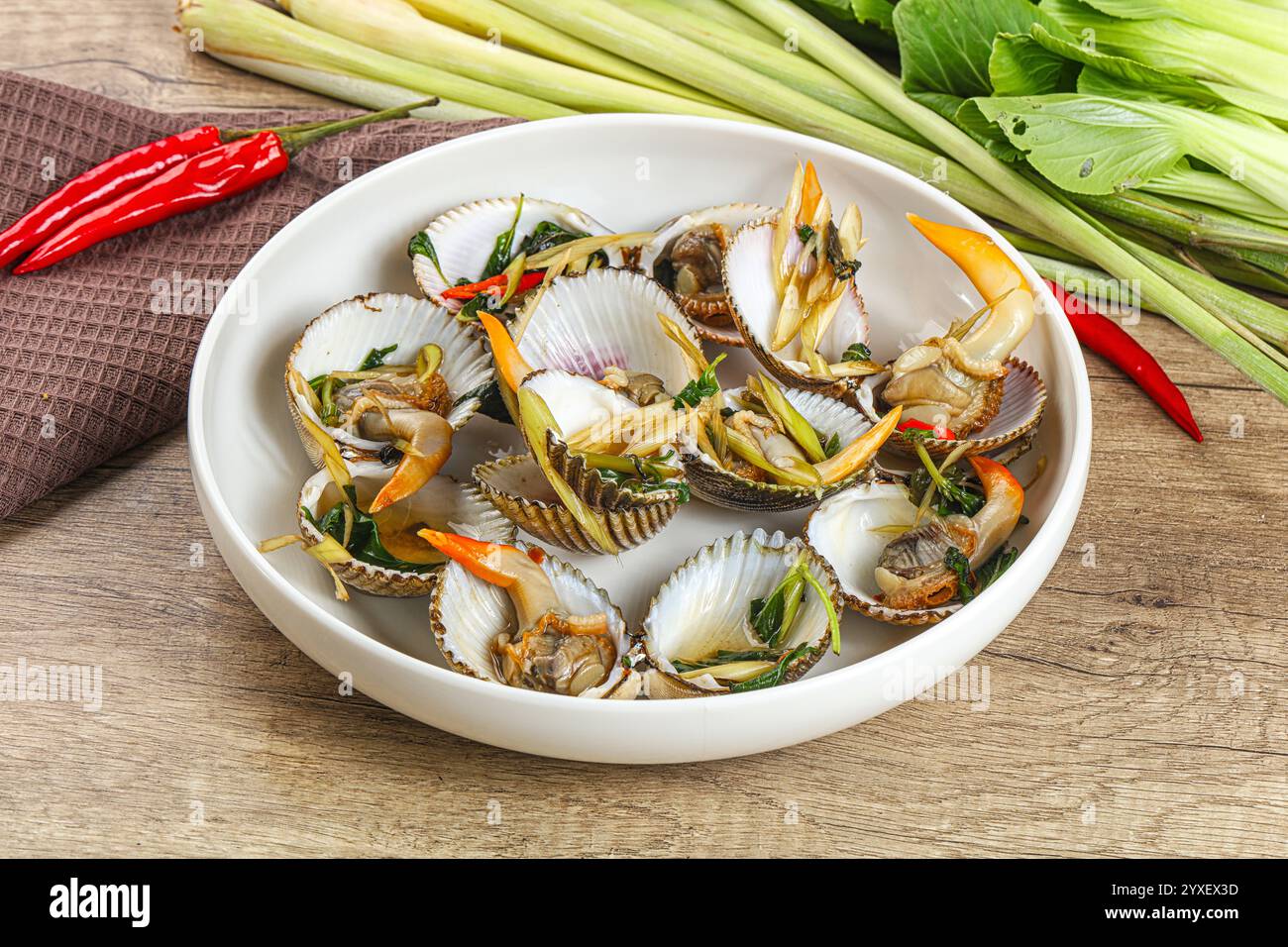 Delicous Asian mollusk shell steamed with spices Stock Photo - Alamy