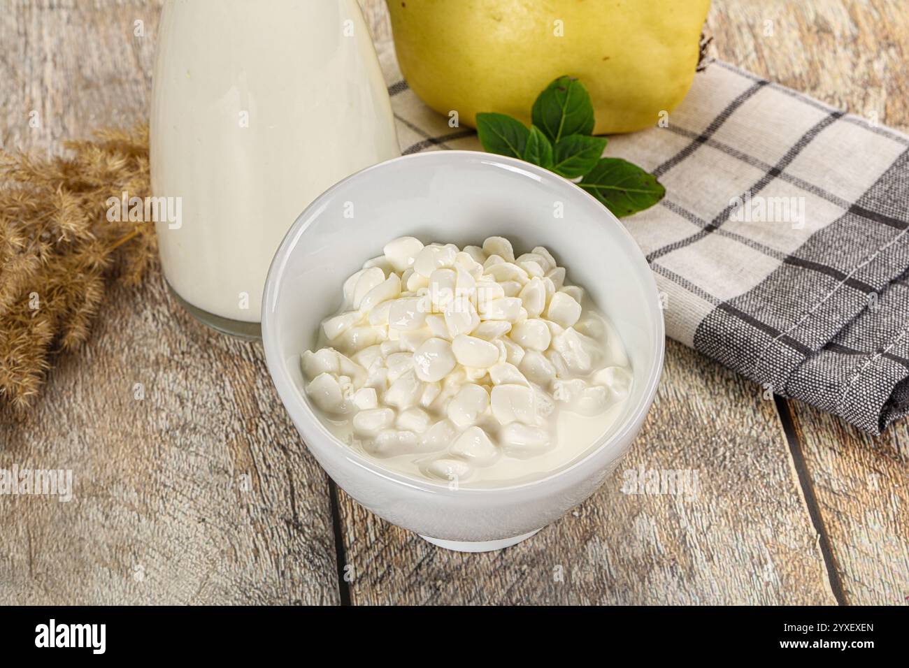 Grain cottage cheese with sour in the bowl Stock Photo - Alamy