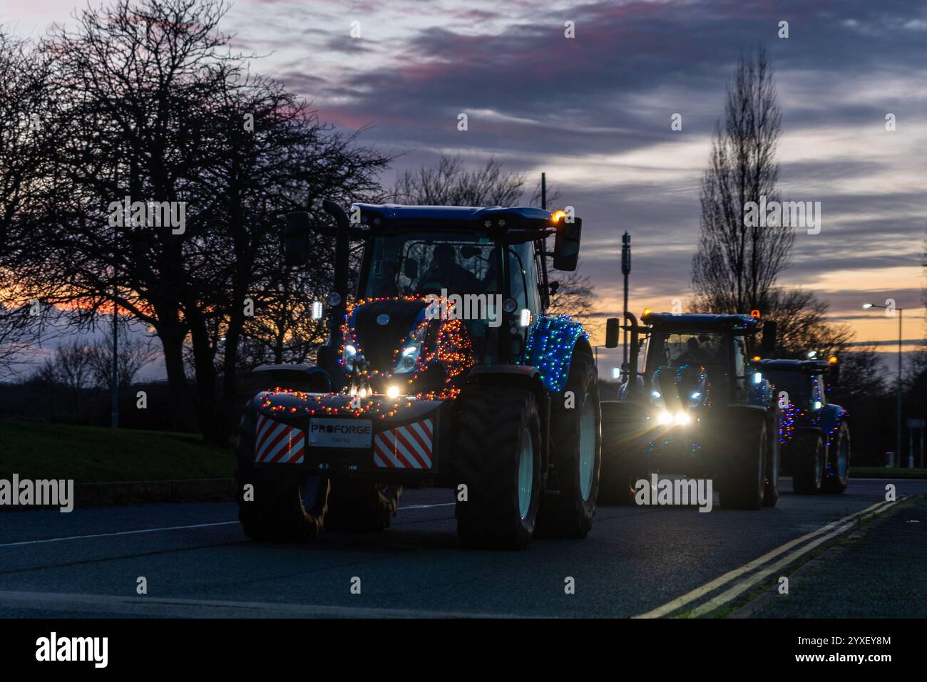 Tractors decorated with festive lights at the Christmas Charity Tractor ...