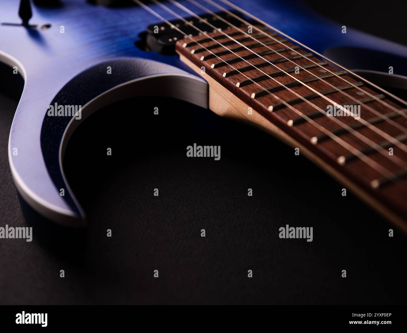 Fretboard of modern electric guitar. Close up Stock Photo - Alamy
