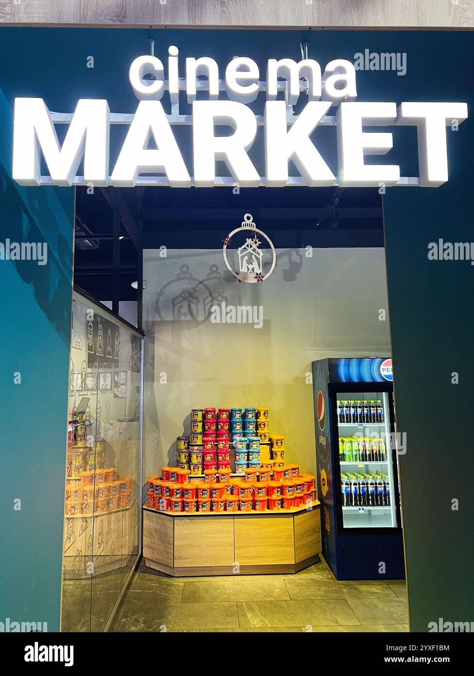 Kyiv, Ukraine - December 15, 2024: An illuminated sign for a cinema ...