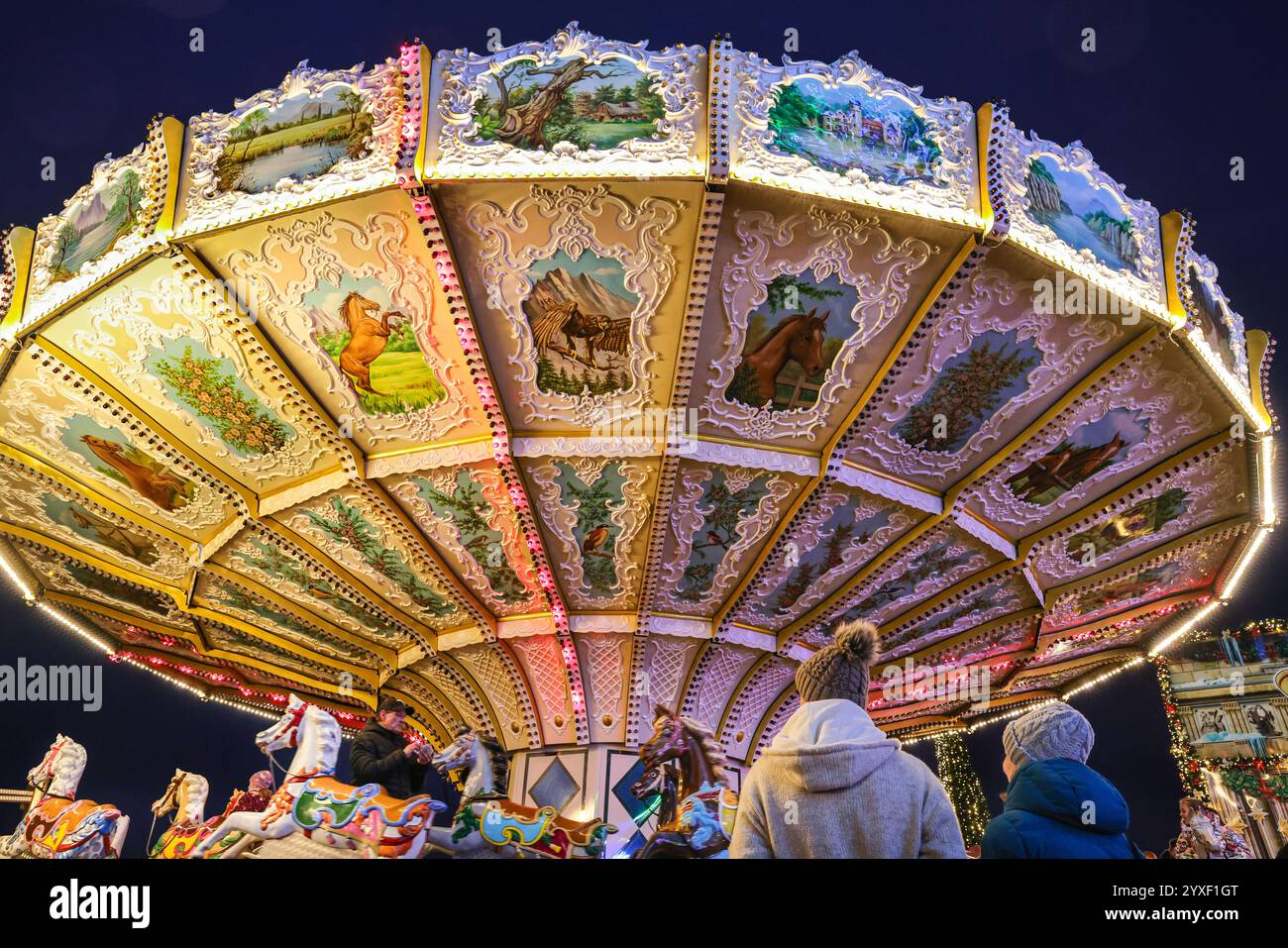 London, UK. 15th Dec, 2024. The 'Old Vienna Horse Carousel' ride proves ...