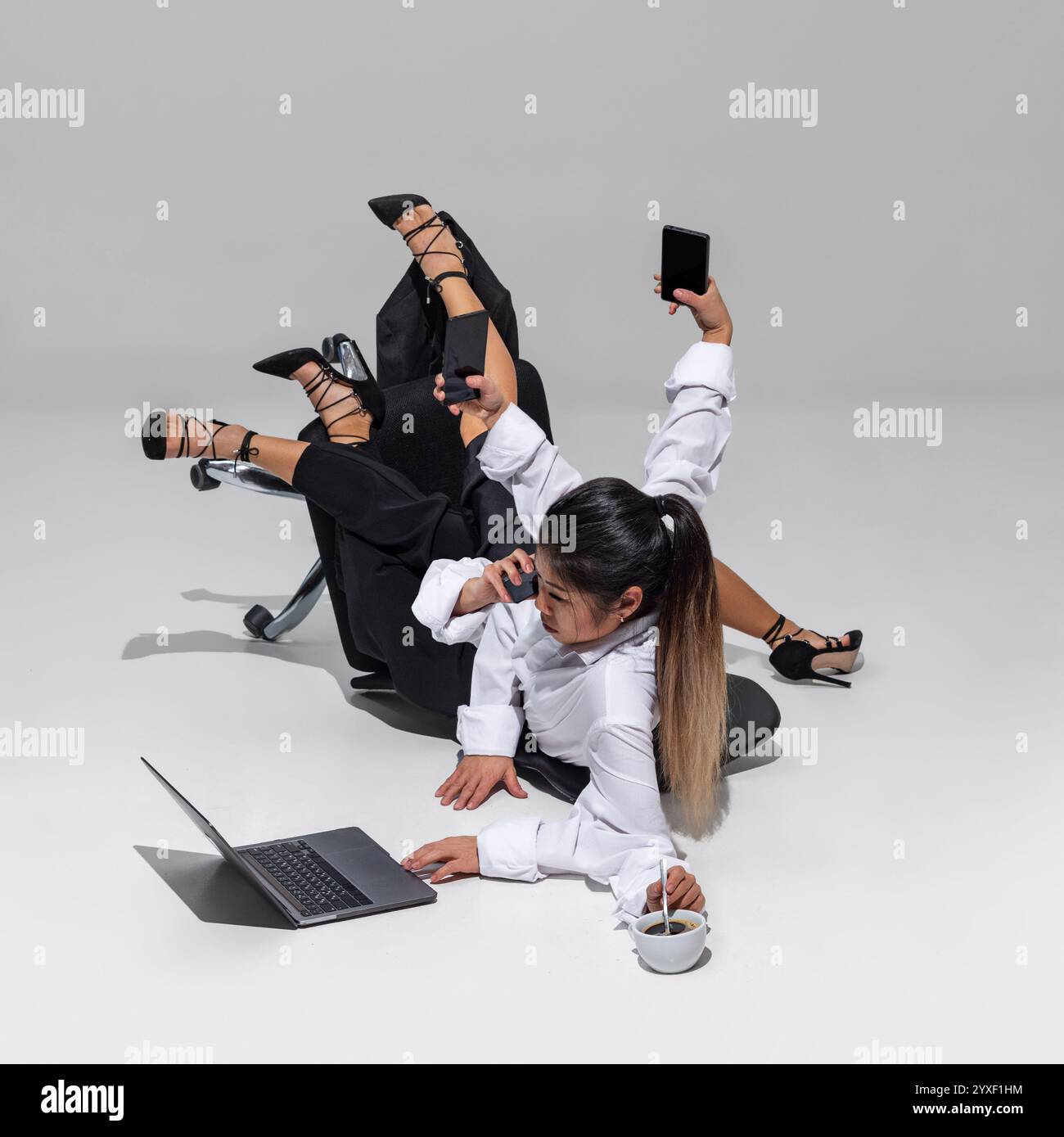 Businesswoman multitasks, balancing multiple roles, holding documents ...