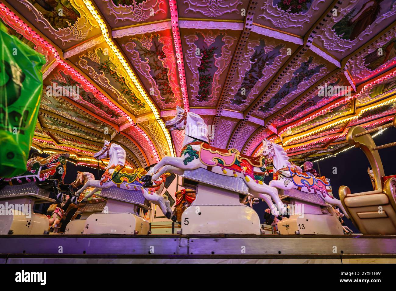 London, UK. 11th Dec, 2024. The 'Old Vienna Horse Carousel' ride proves ...