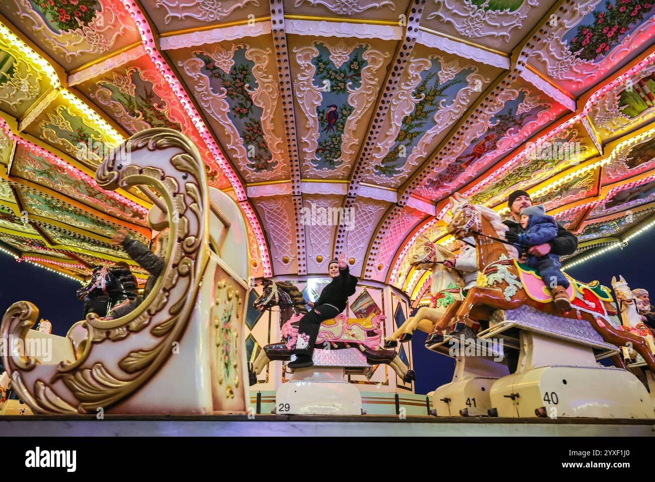 London, UK. 15th Dec, 2024. The 'Old Vienna Horse Carousel' ride proves ...