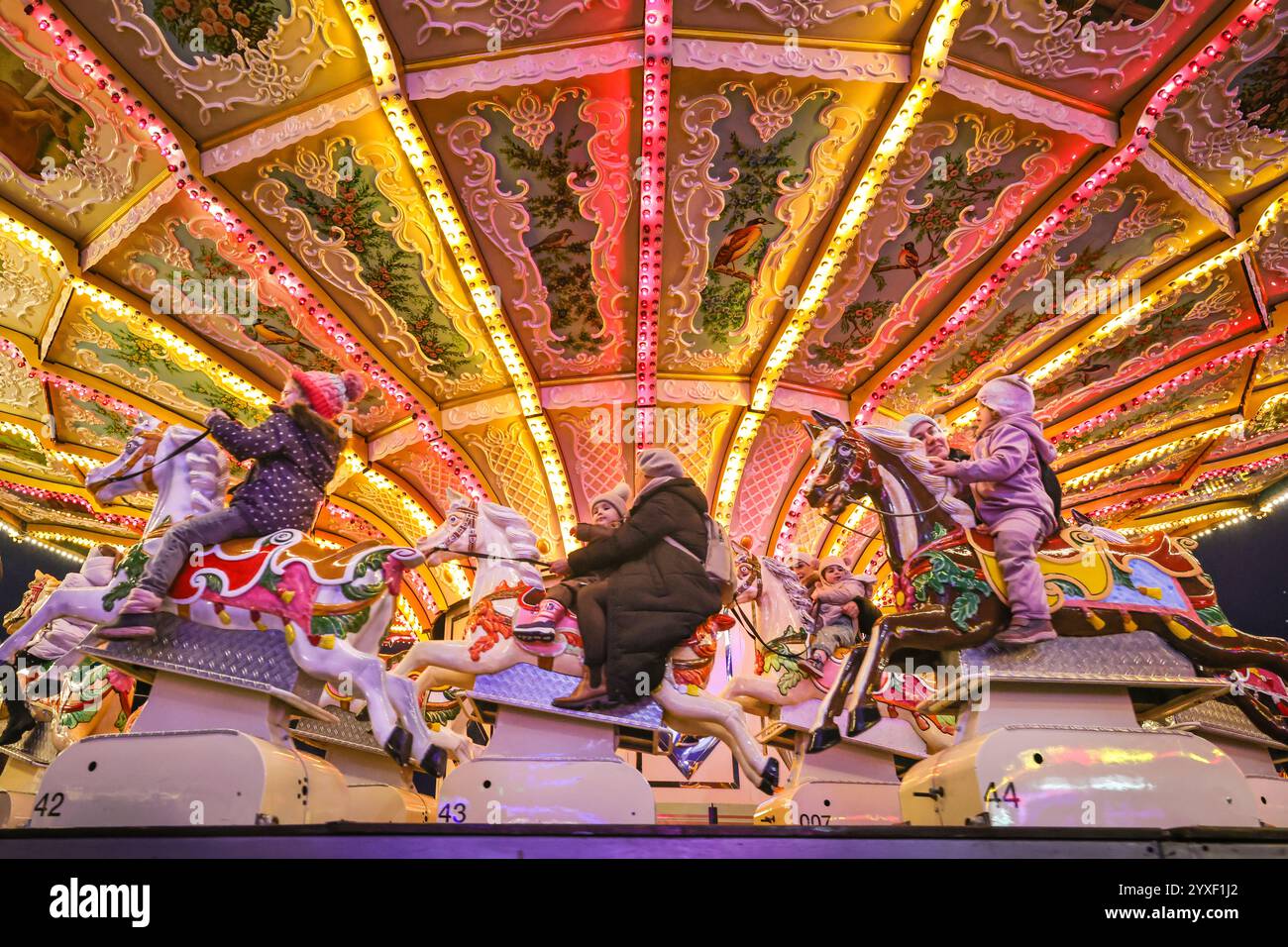 London, UK. 11th Dec, 2024. The 'Old Vienna Horse Carousel' ride proves ...