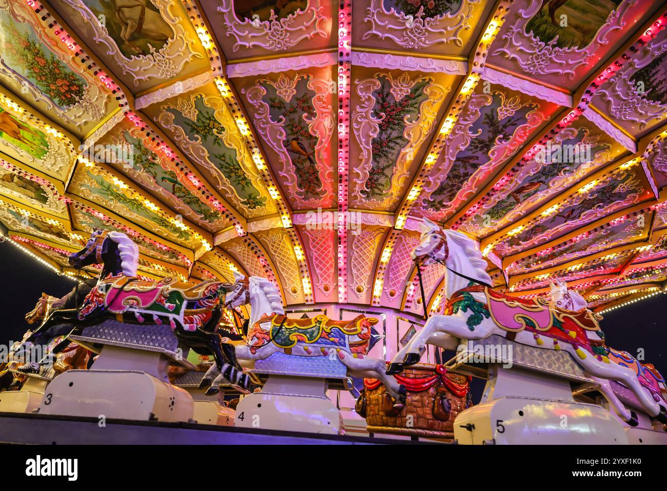 London, UK. 15th Dec, 2024. The 'Old Vienna Horse Carousel' ride proves ...