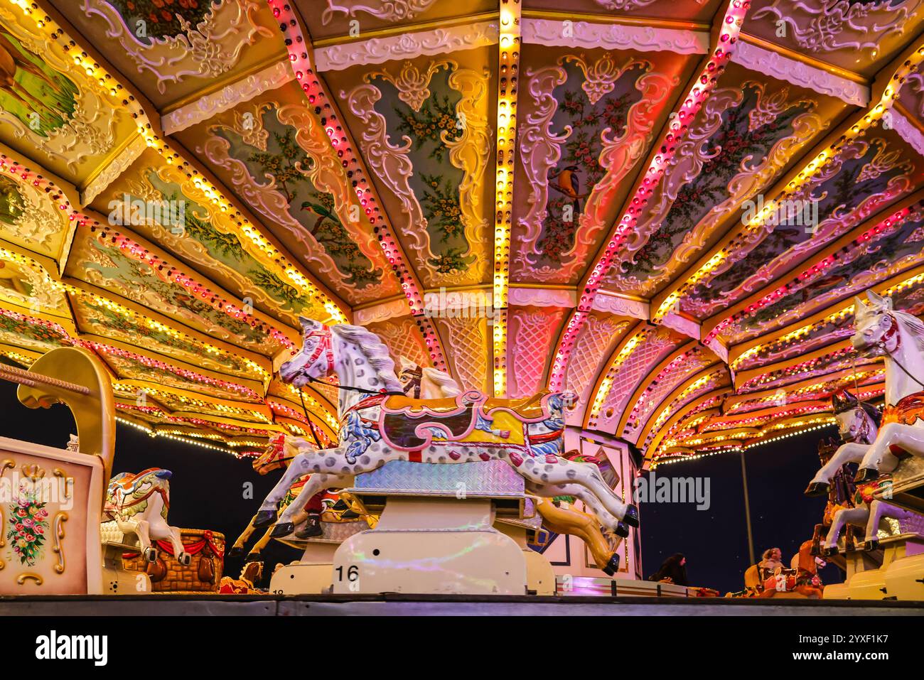 London, UK. 15th Dec, 2024. The 'Old Vienna Horse Carousel' ride proves ...