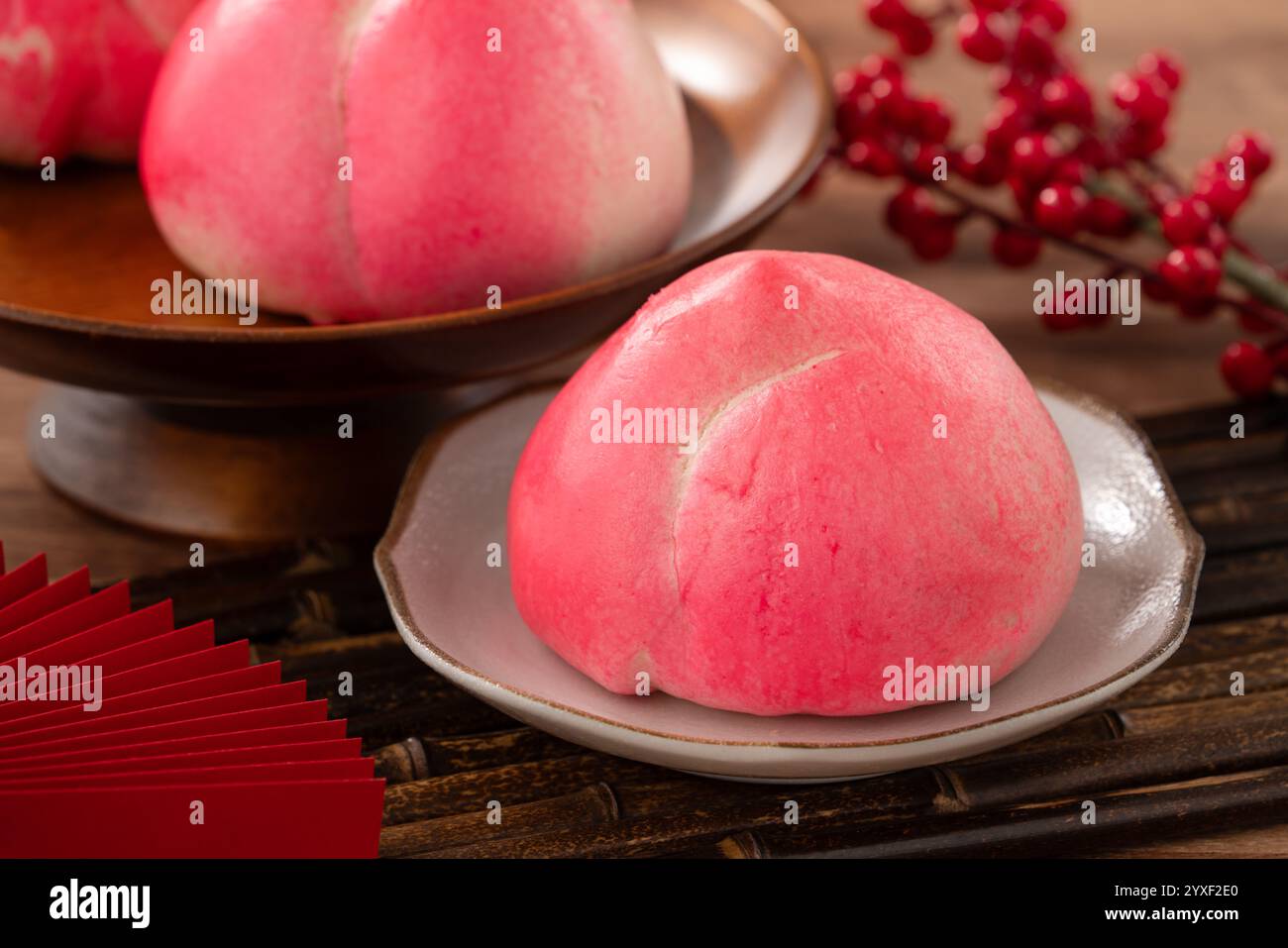 Pink Chinese peach birthday bun food longevity peach shoutao on wooden ...