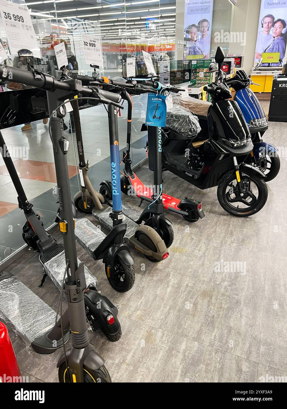 Kyiv, Ukraine - December 15, 2024: A variety of electric scooters and ...