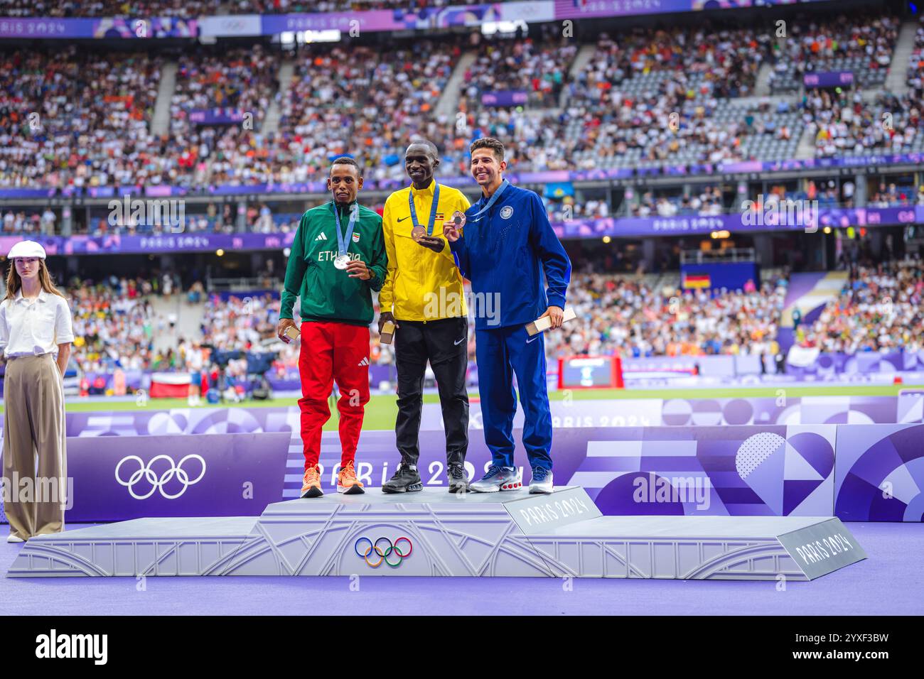 Joshua Cheptegei,Berihu Aregawi and Grant Fisher at the award ceremony ...