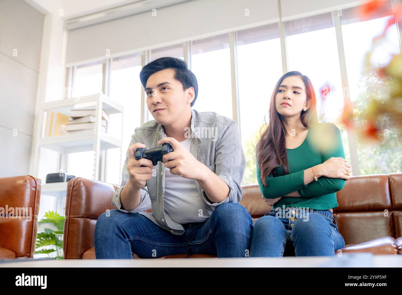 Young asian couple playing games hi-res stock photography and images ...