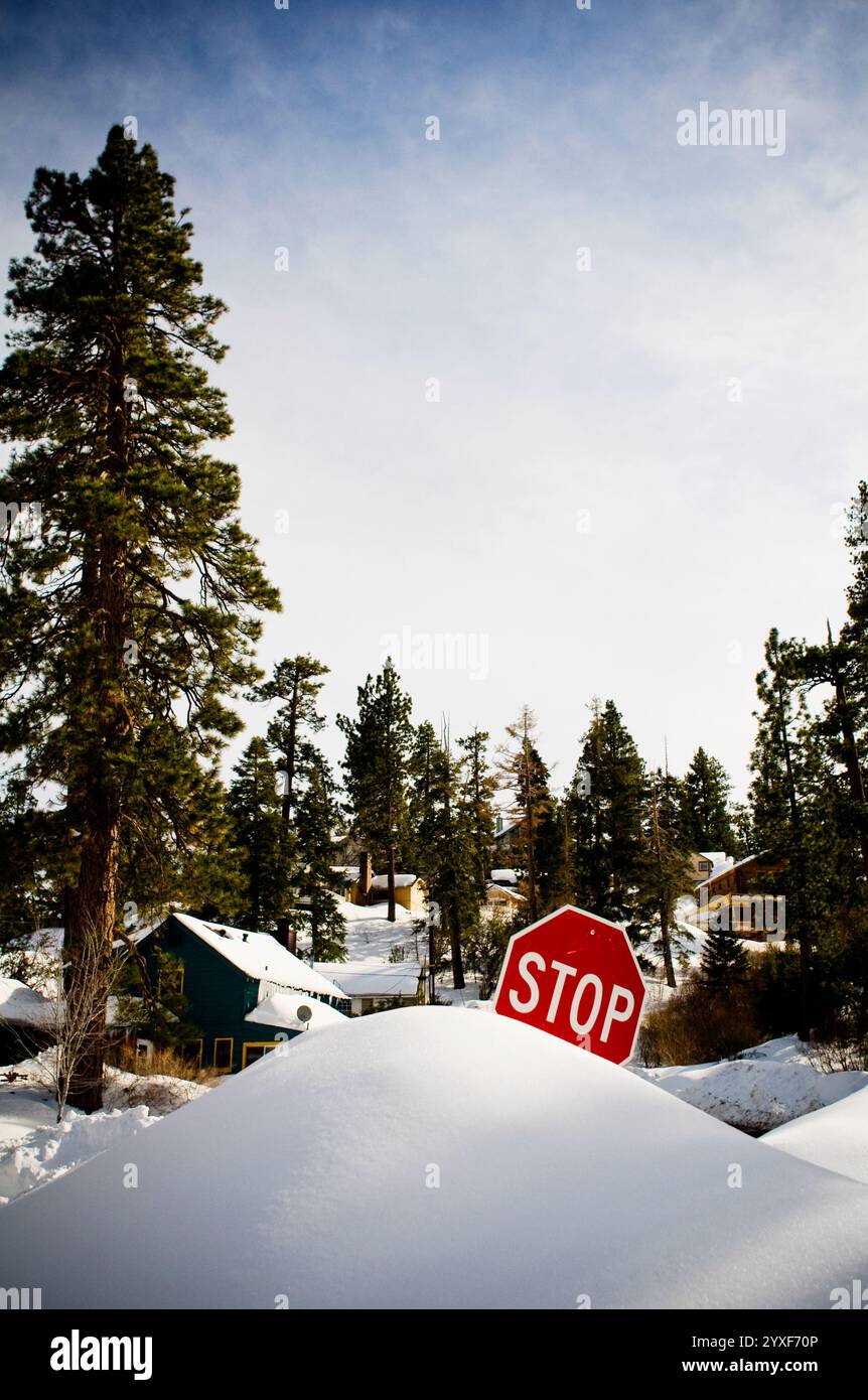 A stop sign is burried in a snow drift after a large winter storm Stock ...