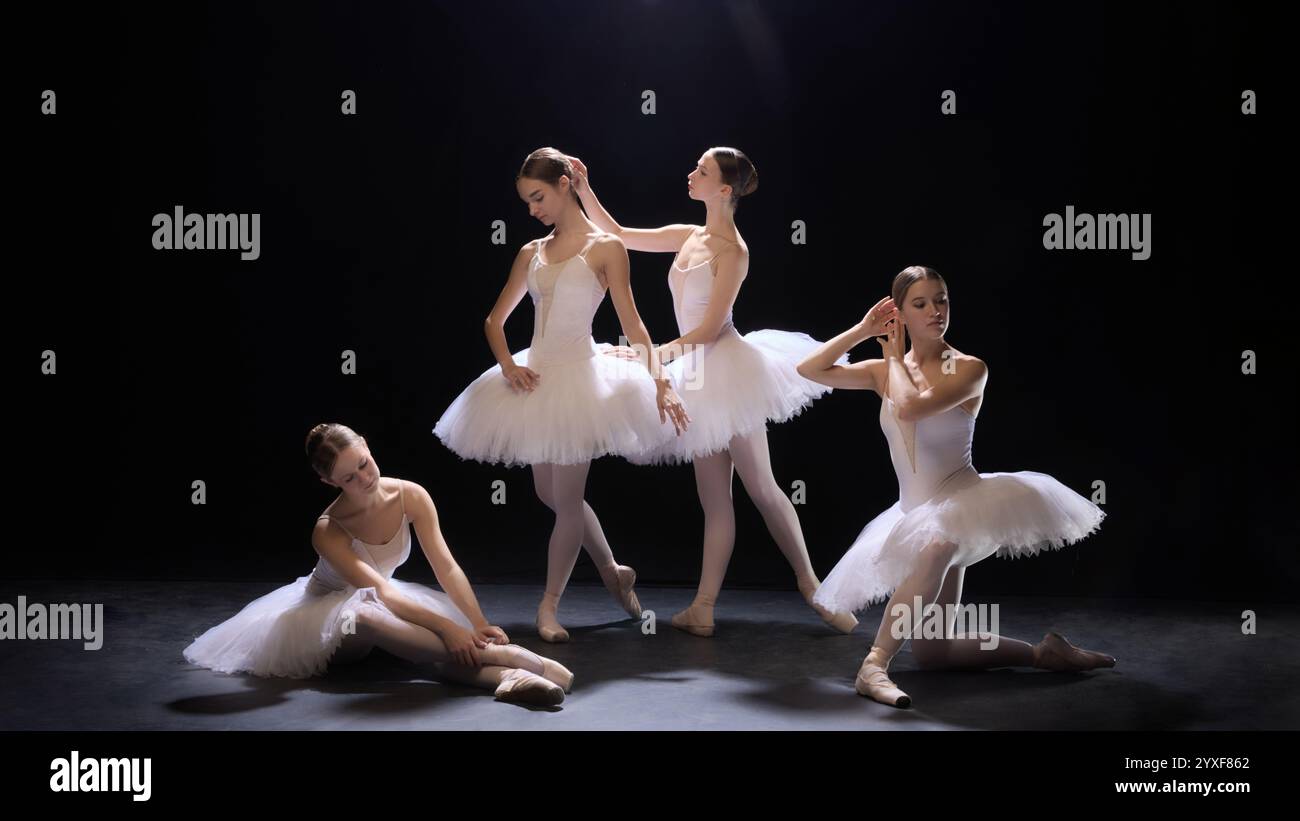 Four ballet dancers in elegant white tutus making graceful, beautiful ...
