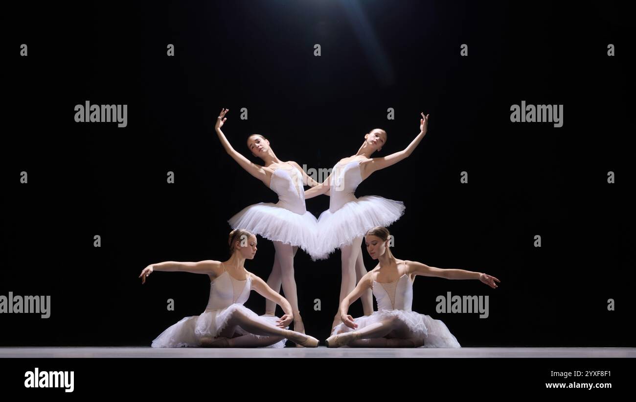 Four elegant young girls, ballet dancers in artistic group pose, making ...