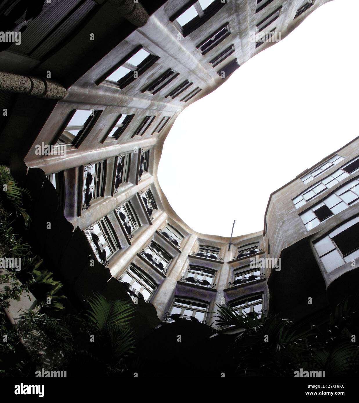 Low angle view looking up within the courtyard and curved atrium of the ...