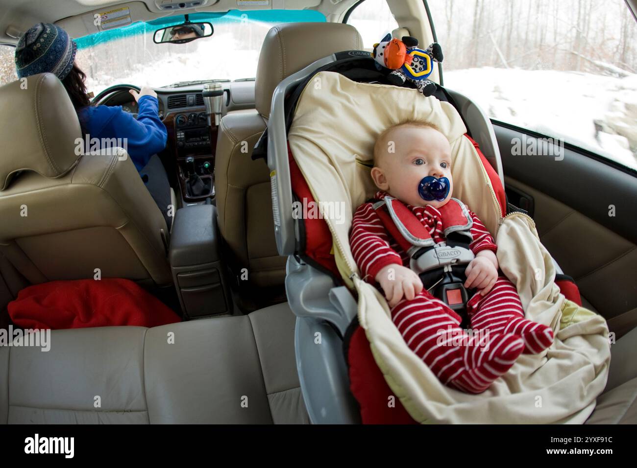 A baby driving in a car with her mother Stock Photo - Alamy