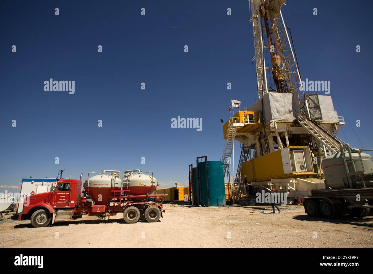 An energy company's cement team prepares their gear at a drill rig on ...