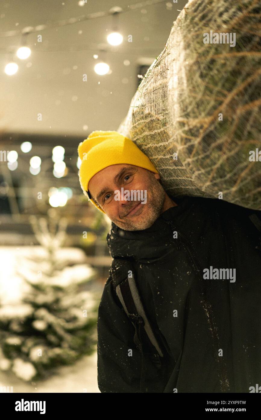 Man carrying tree with hi-res stock photography and images - Alamy