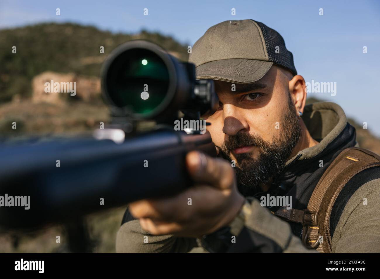 Hunter aiming with rifle in nature during hunt Stock Photo - Alamy