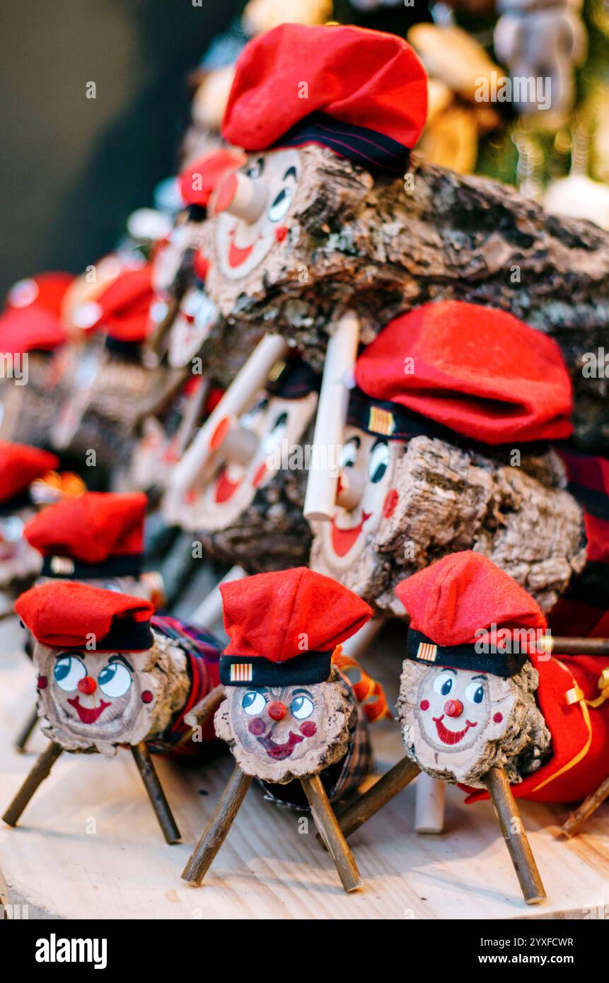Traditional Catalan Tió de Nadal logs with cheerful faces at a ...
