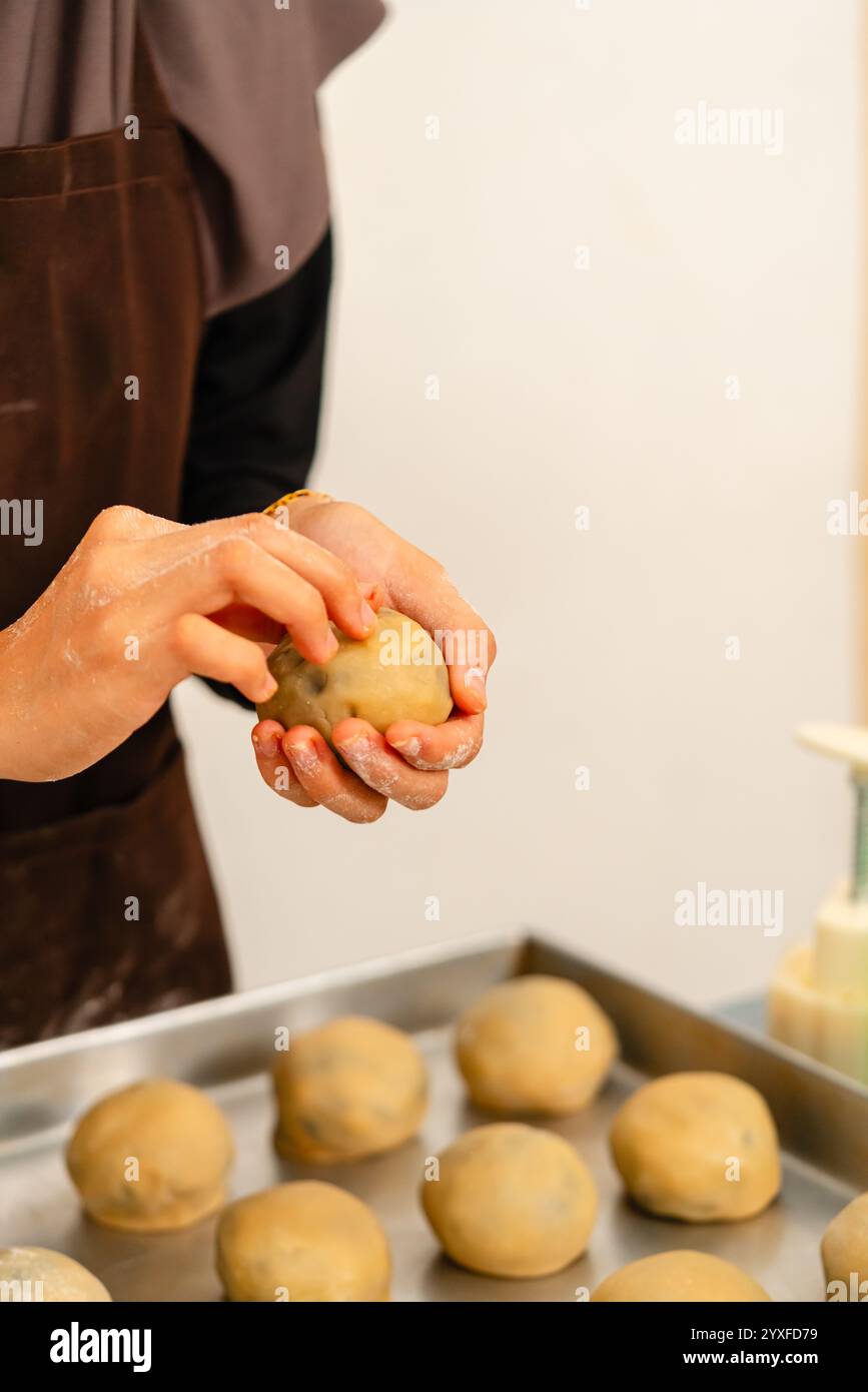 Mooncake making process. A mooncake is a Chinese bakery product ...