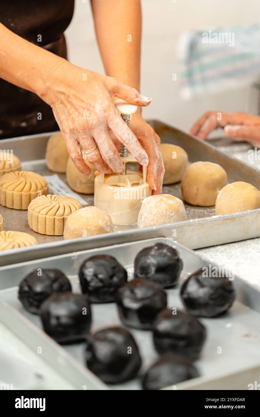Mooncake making process. A mooncake is a Chinese bakery product ...