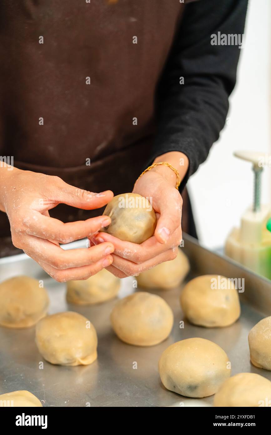 Mooncake making process. A mooncake is a Chinese bakery product ...