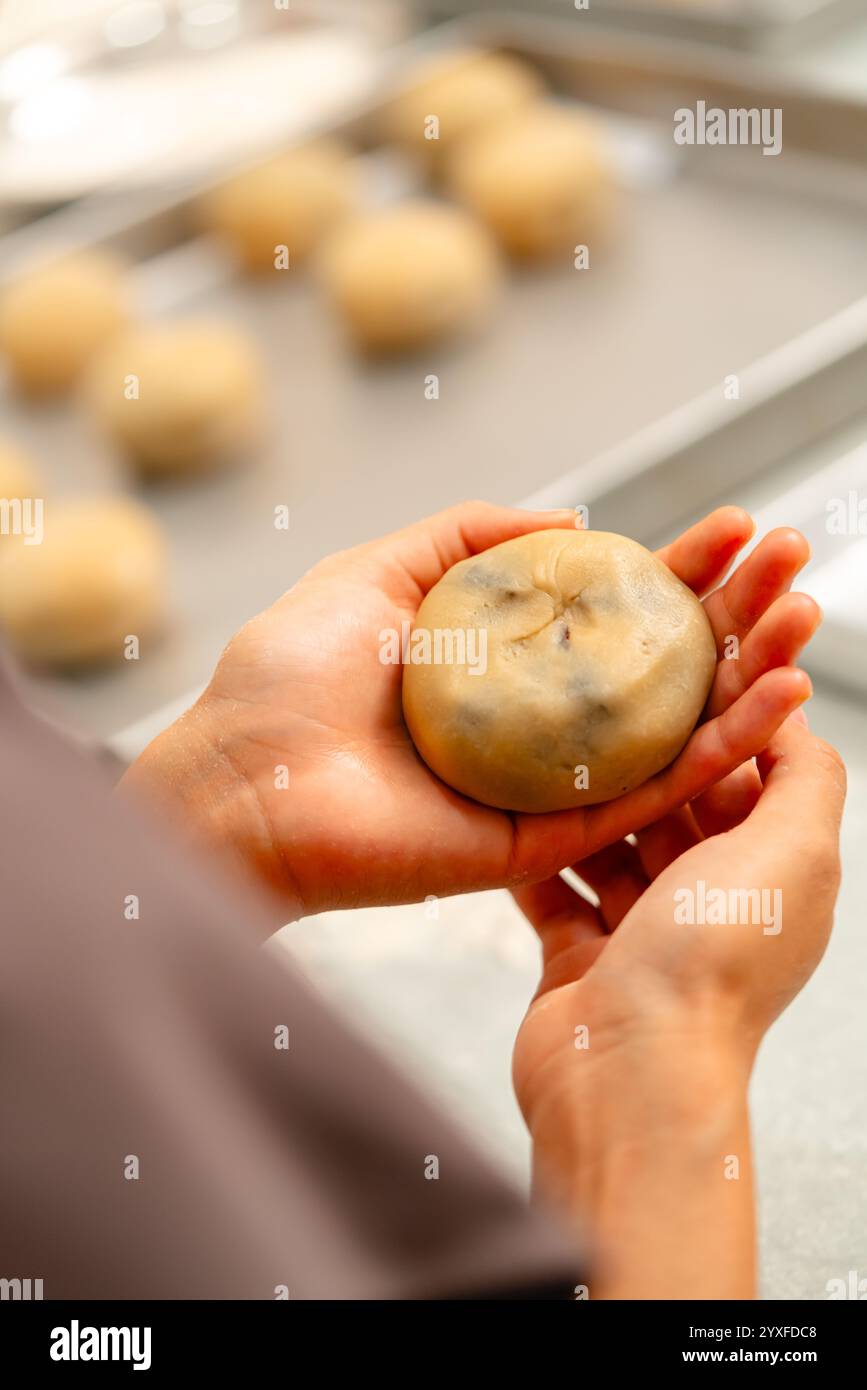 Mooncake making process. A mooncake is a Chinese bakery product ...