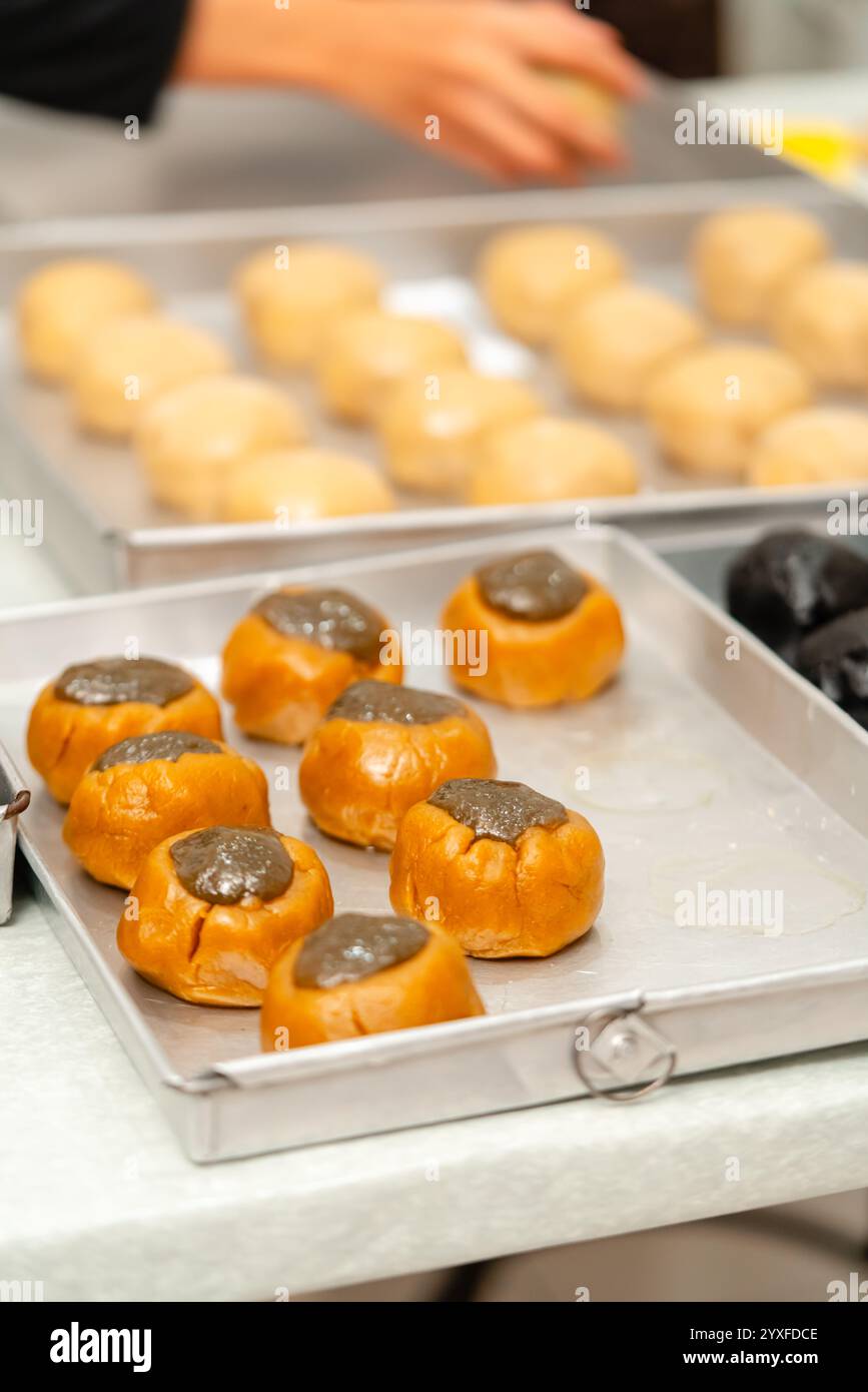 Mooncake making process. A mooncake is a Chinese bakery product ...