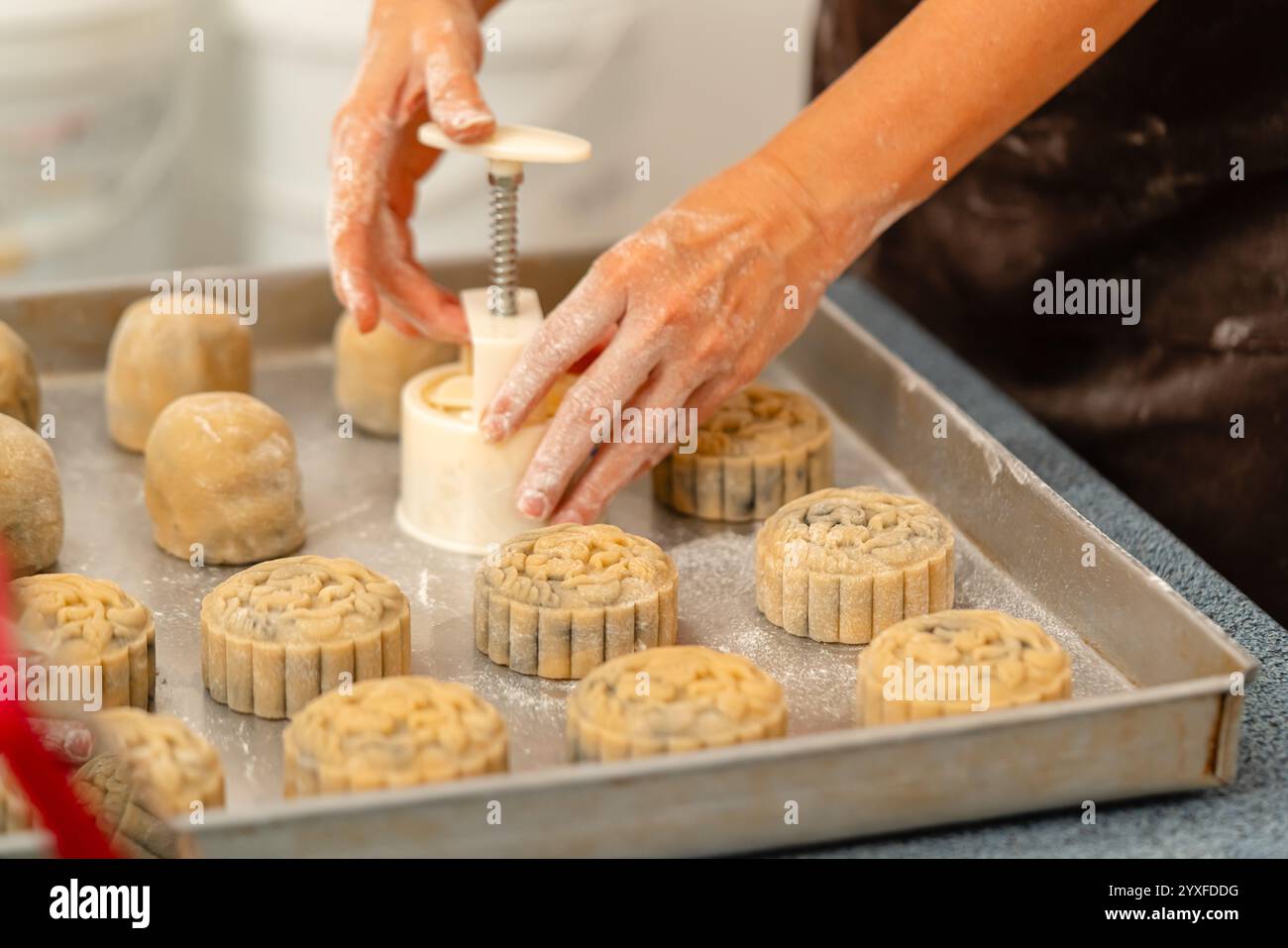 Mooncake making process. A mooncake is a Chinese bakery product ...