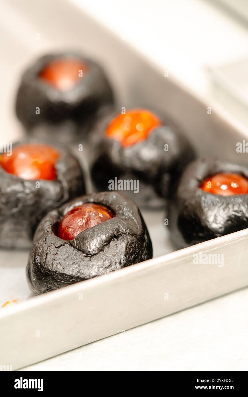 Mooncake making process. A mooncake is a Chinese bakery product ...