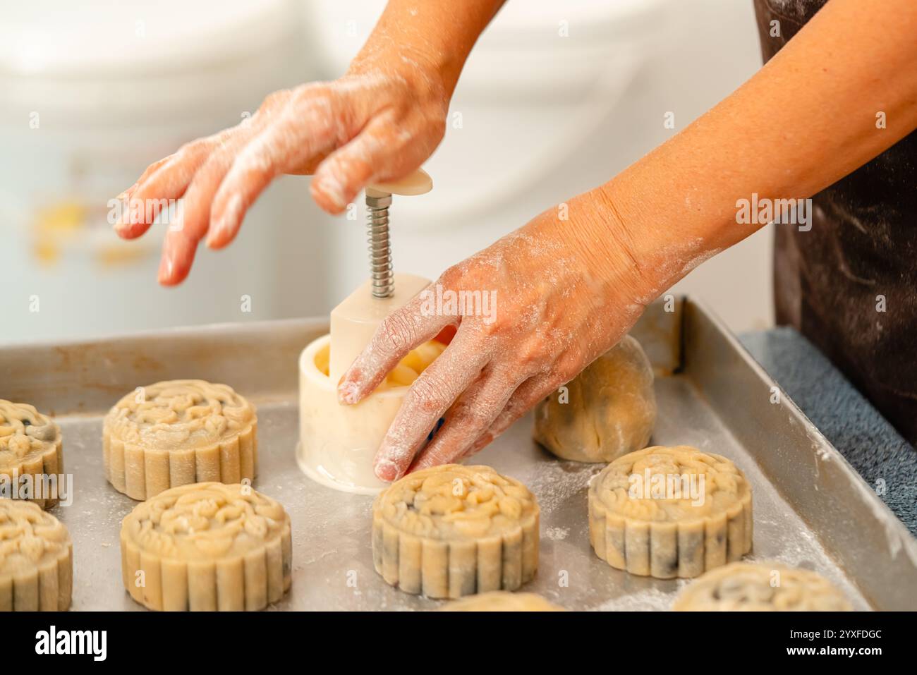 Mooncake making process. A mooncake is a Chinese bakery product ...