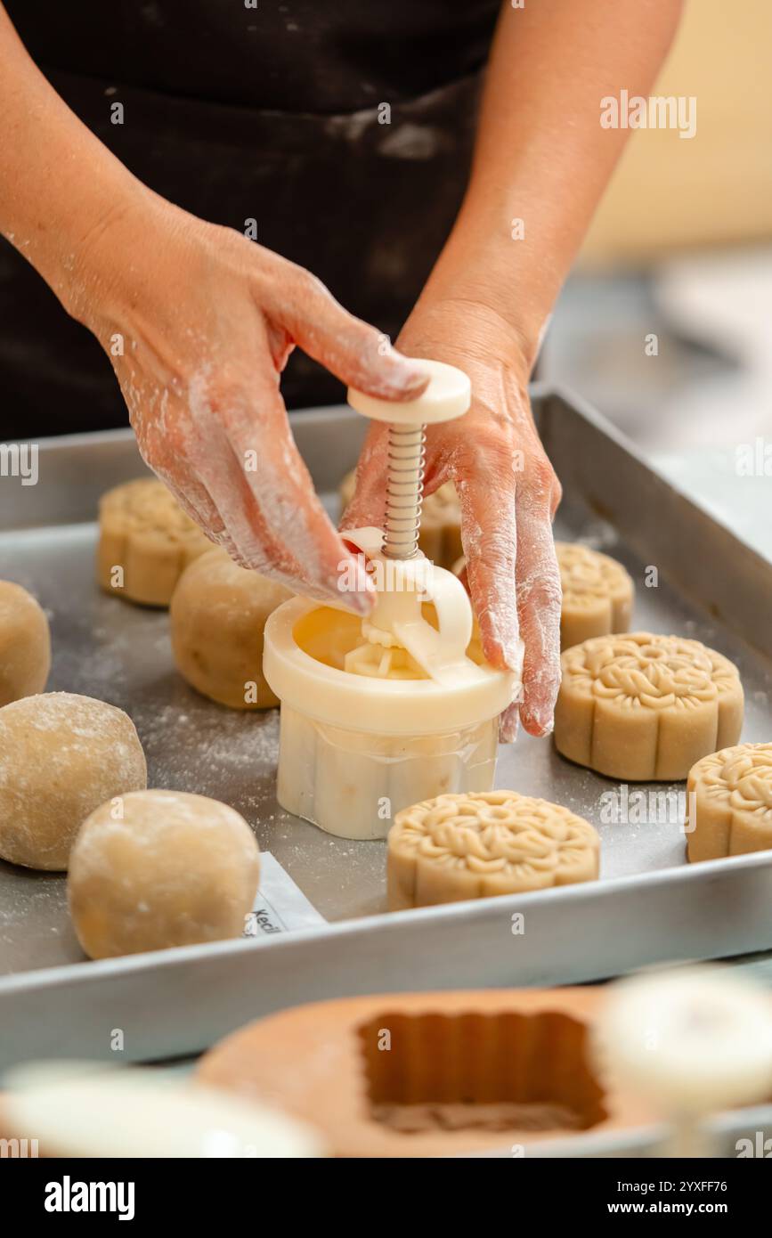 Mooncake making process. A mooncake is a Chinese bakery product ...