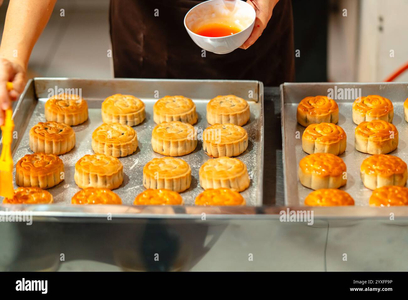 Mooncake making process. A mooncake is a Chinese bakery product ...