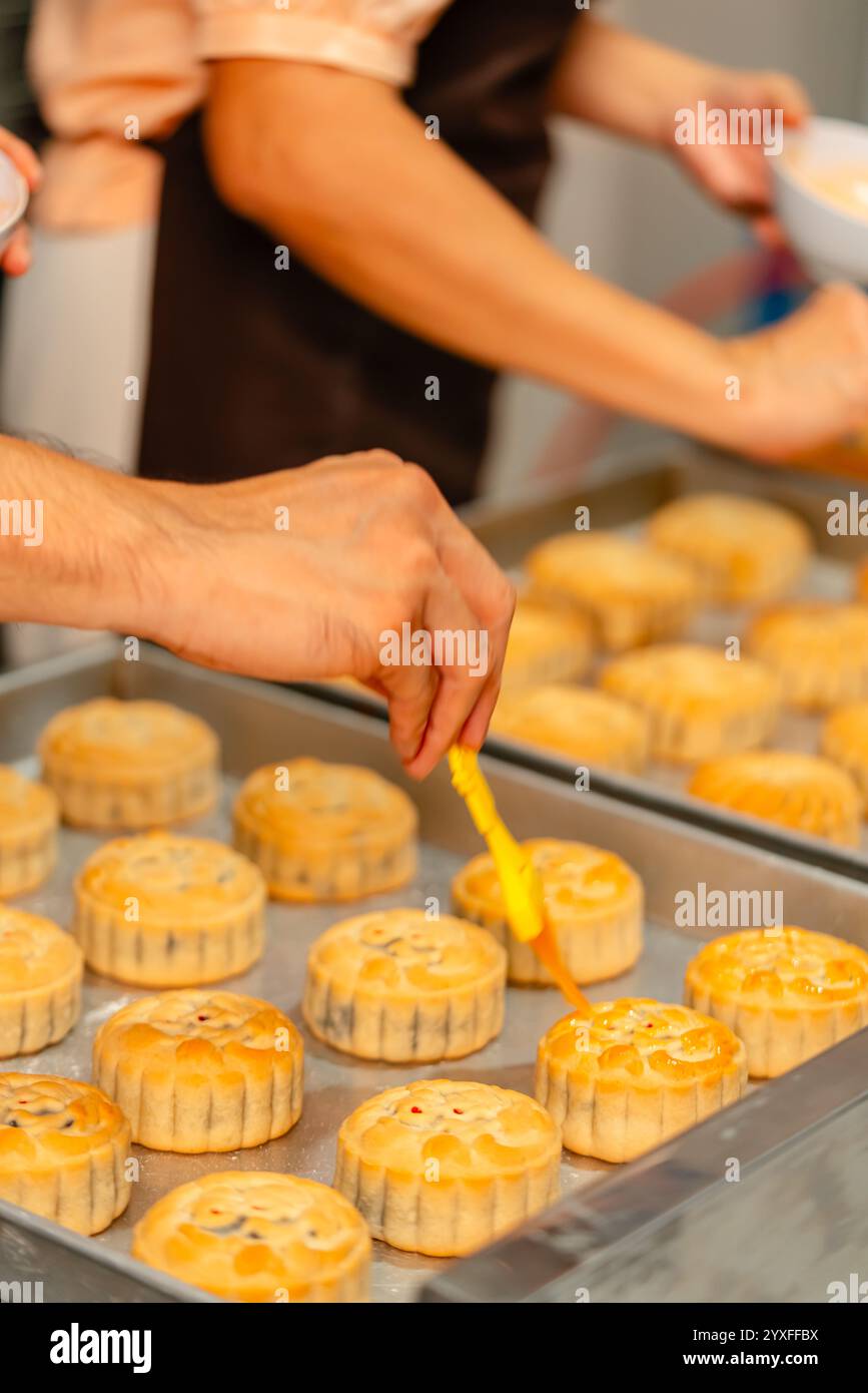 Mooncake making process. A mooncake is a Chinese bakery product ...