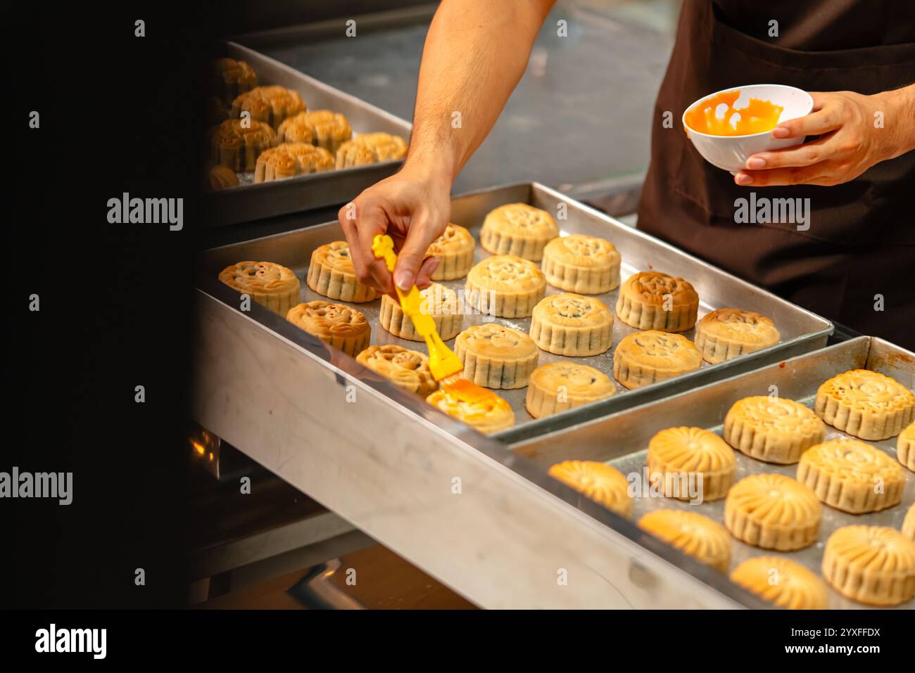 Mooncake making process. A mooncake is a Chinese bakery product ...