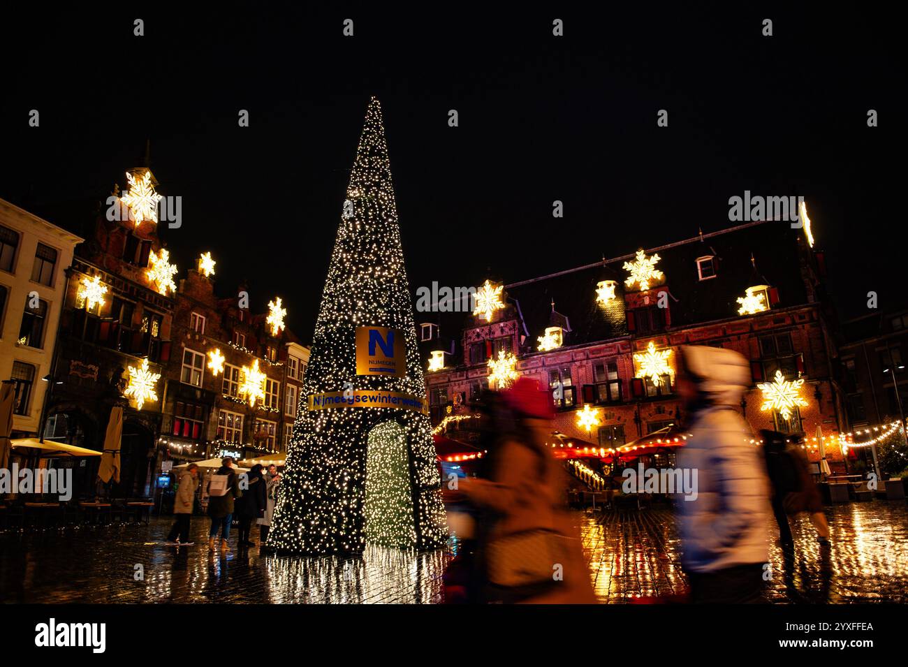 Nijmegen, Netherlands. 15th Dec, 2024. An illuminated tree is seen ...