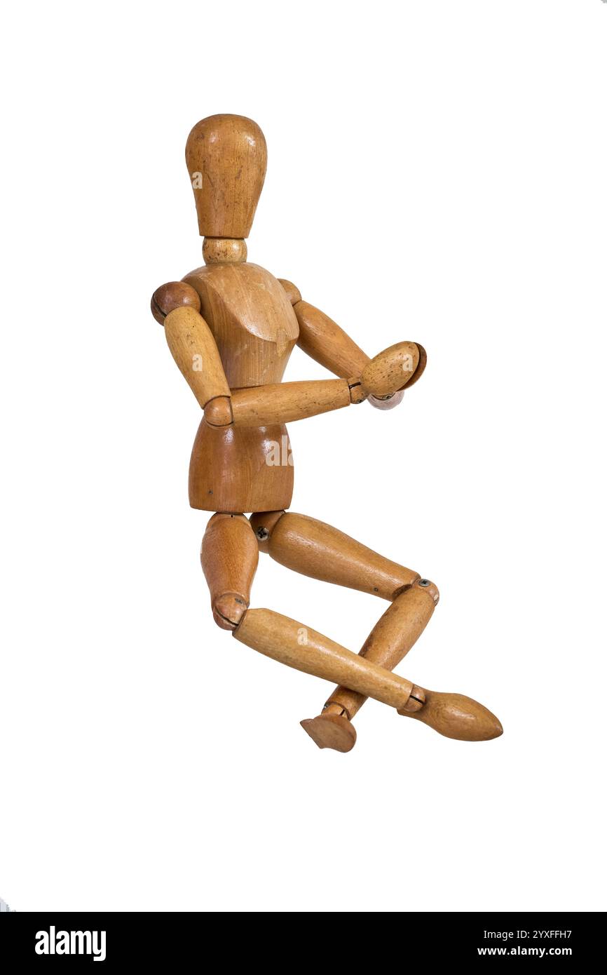 Wooden dummy posing against white background Stock Photo - Alamy