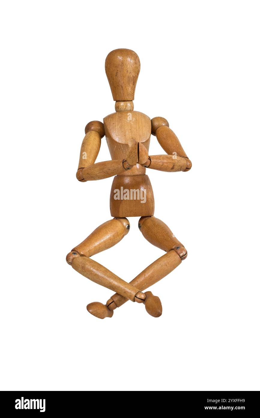 Wooden dummy posing against white background Stock Photo - Alamy