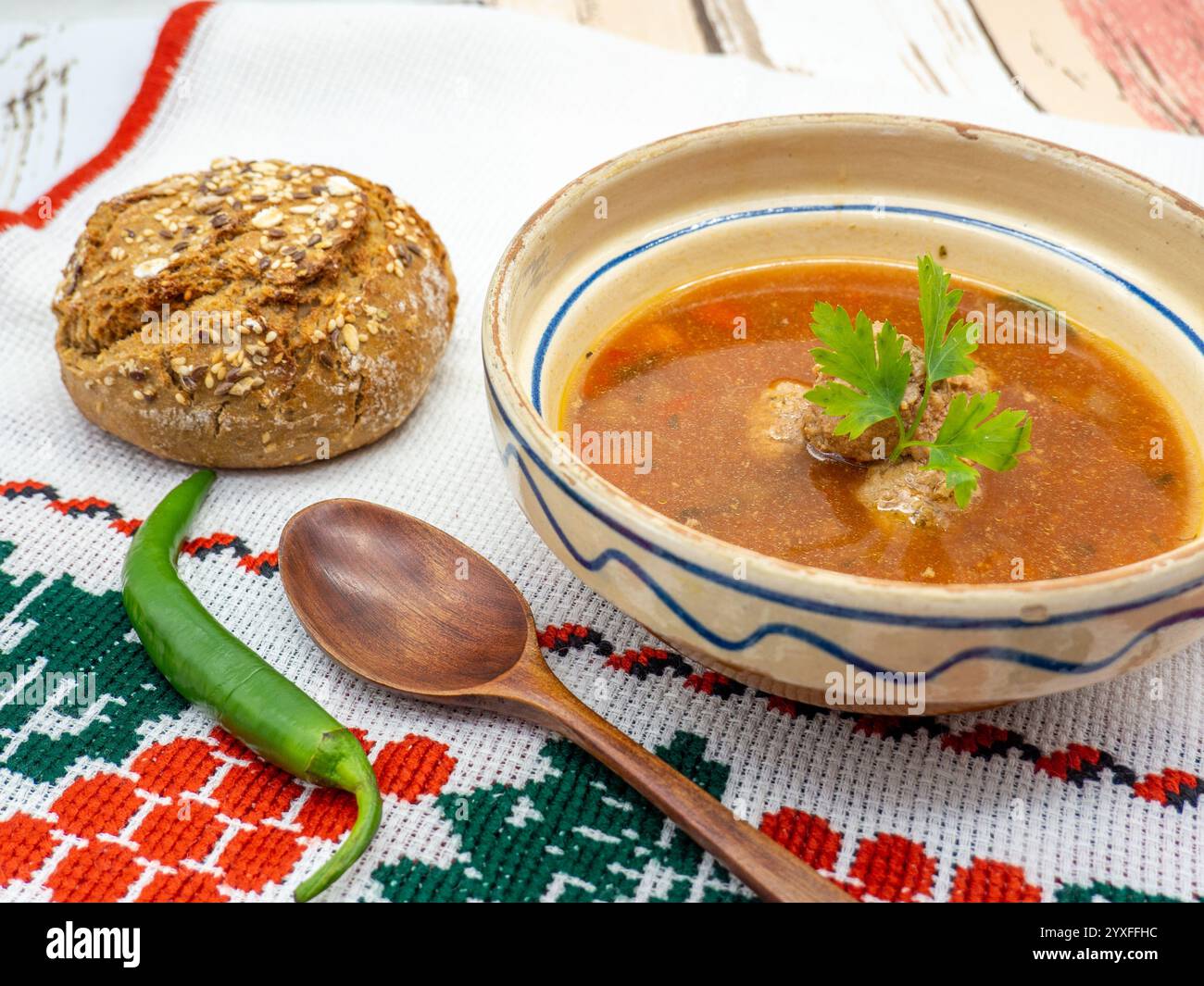 romanian dish ciorba de perisoare or meat ball soup Stock Photo - Alamy