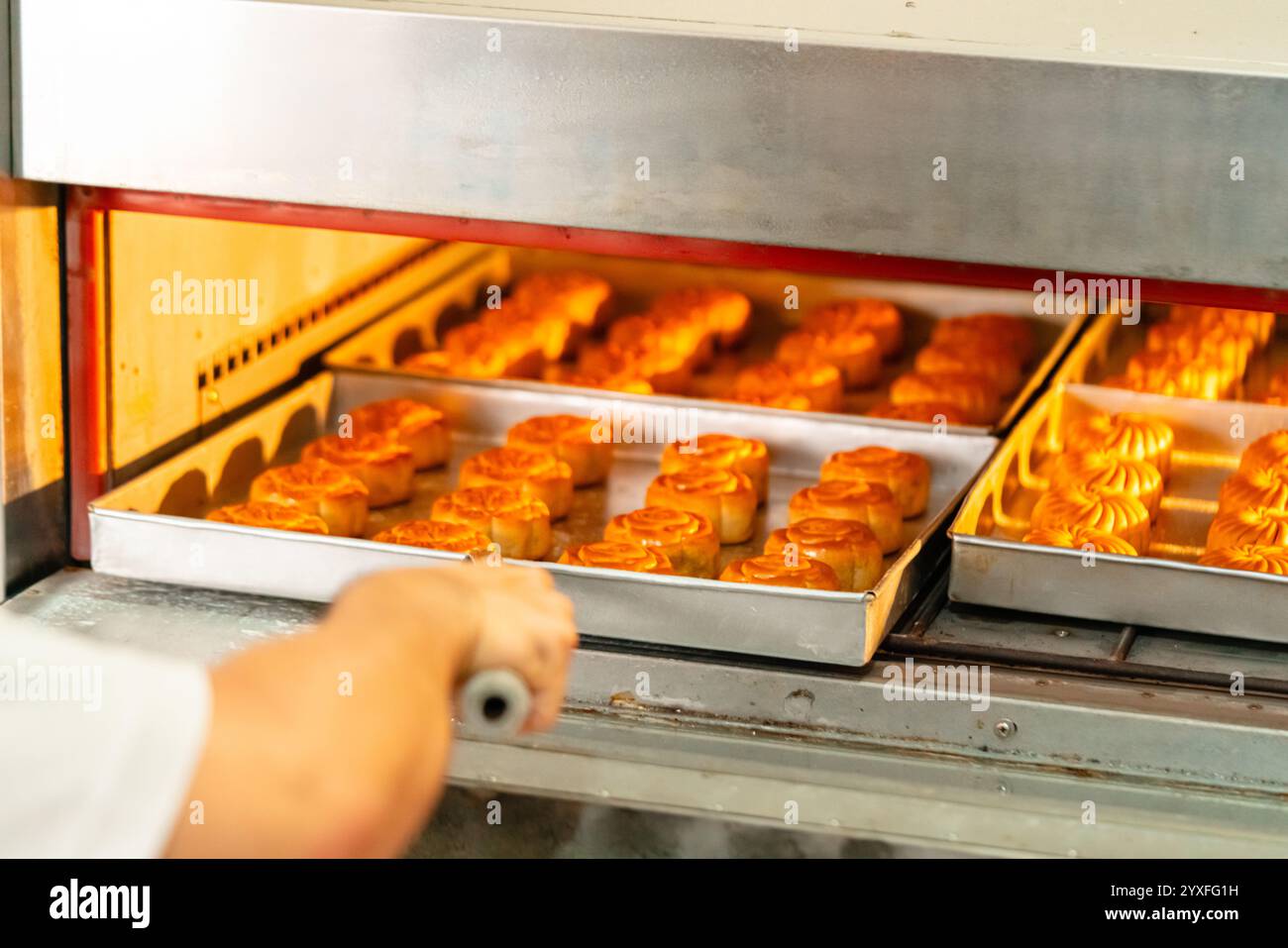Mooncake making process. A mooncake is a Chinese bakery product ...