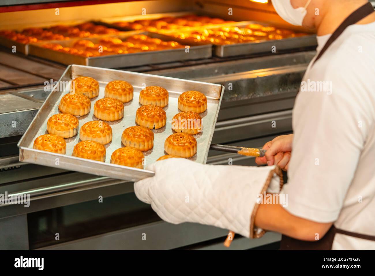 Mooncake making process. A mooncake is a Chinese bakery product ...